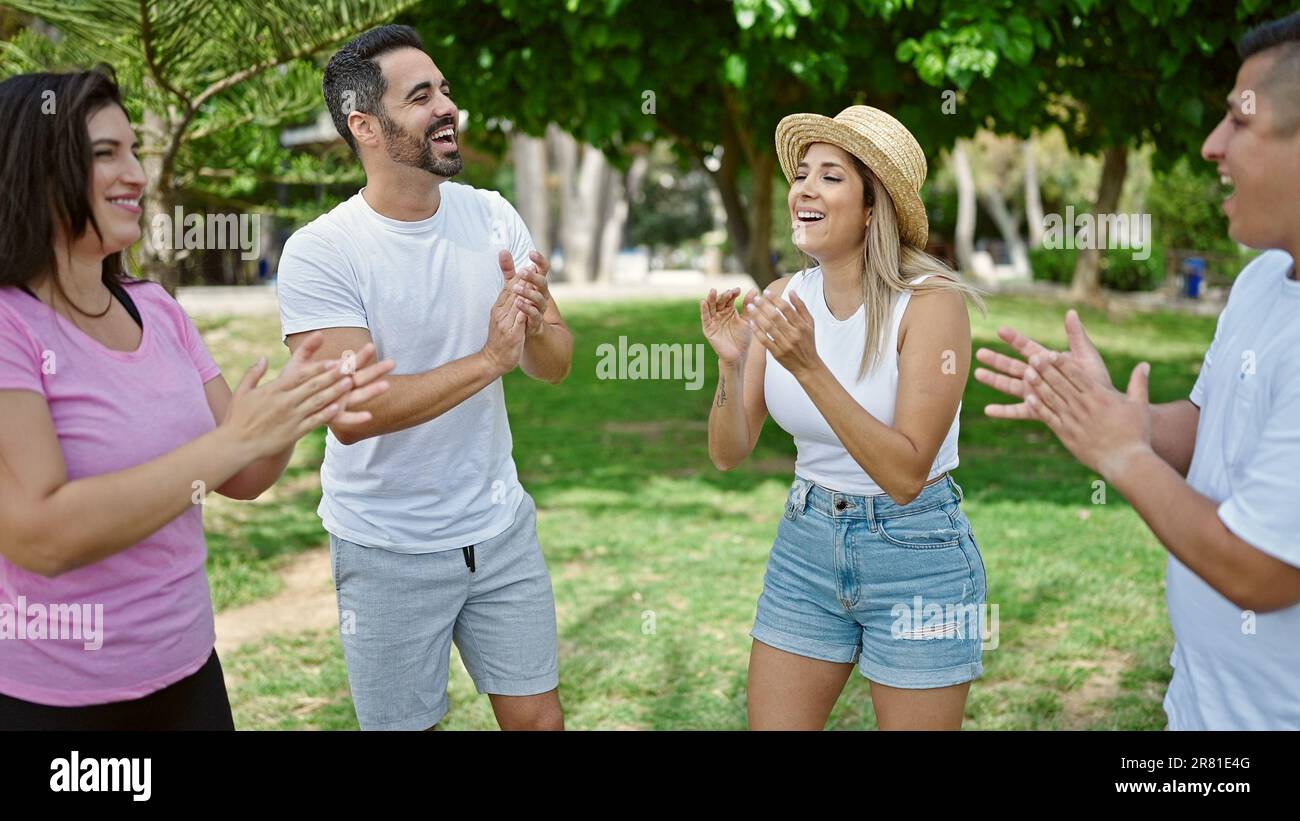 Group of people smiling confident clapping applause at park Stock Photo ...