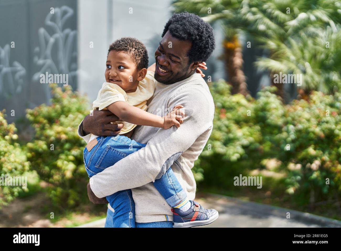 Father and son hugging each other at playground Stock Photo - Alamy