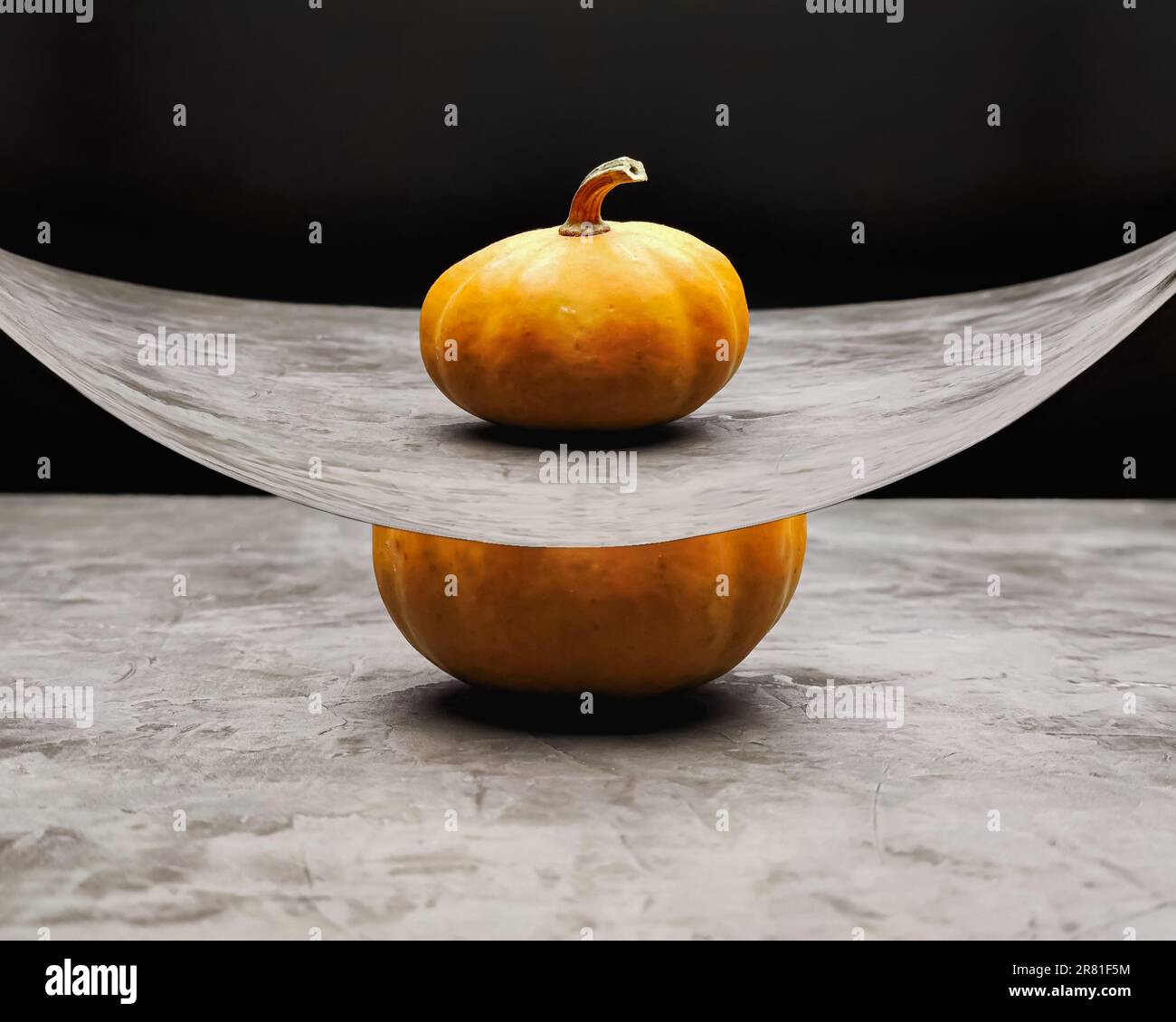 Unusual halloween - abstract picture with orange pumpkin on a concrete ...
