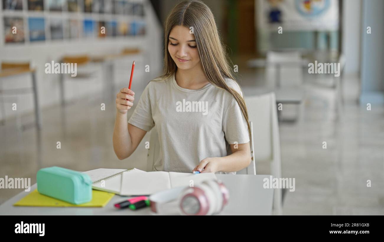 Student playing with pen classroom hi-res stock photography and images ...
