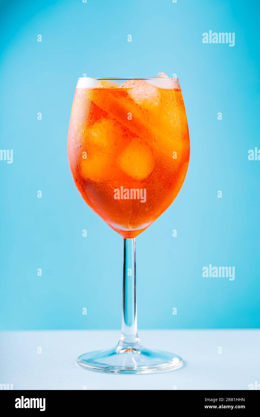 Aperol Spritz cocktail in glass on a blue background. Classic italian ...
