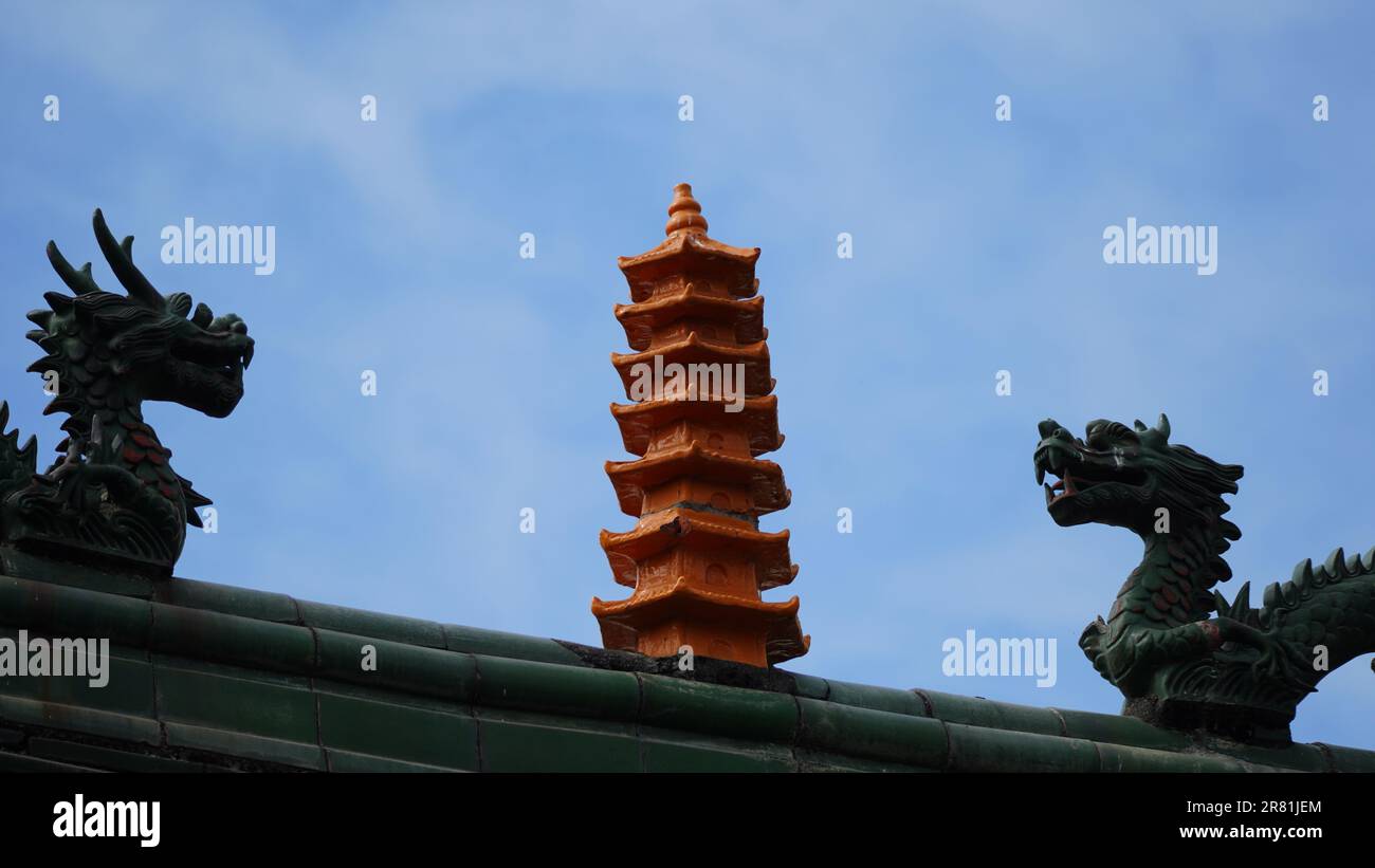 A traditional Asian pagoda stands tall in a scenic landscape, decorated ...