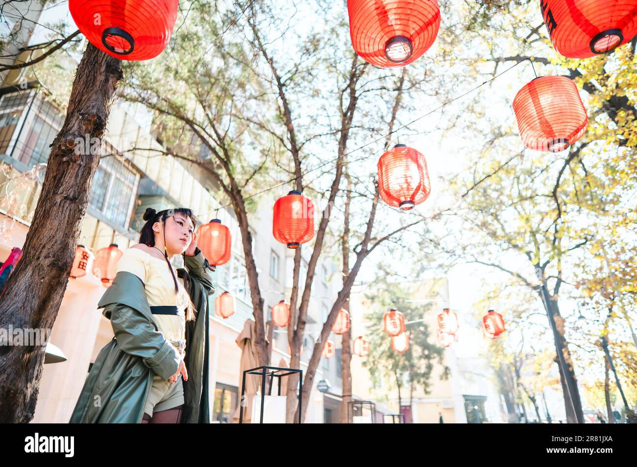 Portrait of an Asian woman against the background of Chinese lanterns ...