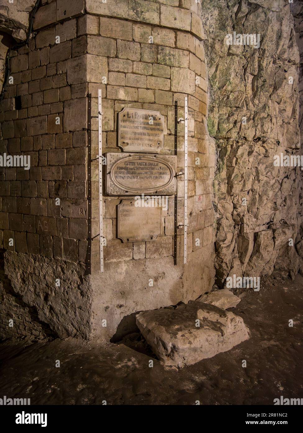 The image is of an information plaque at the medieval underground city ...