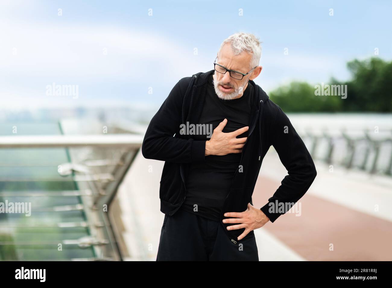 Mature caucasian man touching chest hi-res stock photography and images ...