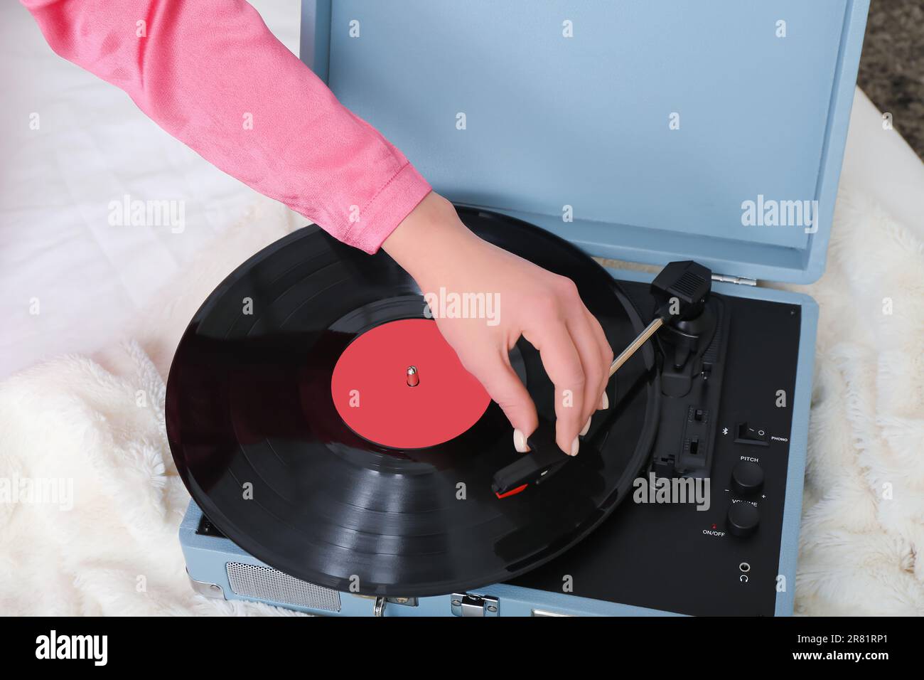 Young woman with record player in bedroom, closeup Stock Photo - Alamy