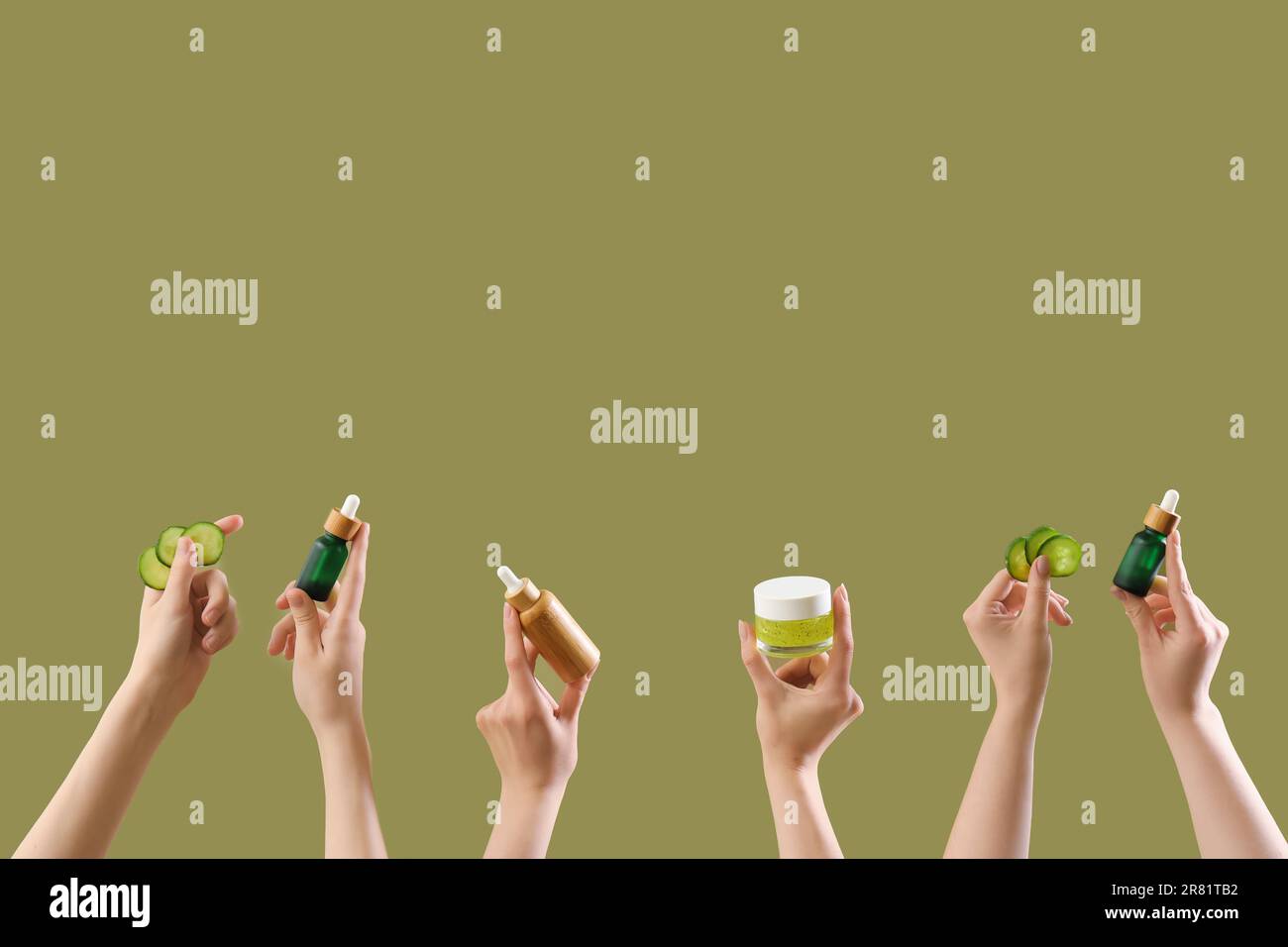 Hands holding different cosmetic products on color background Stock ...