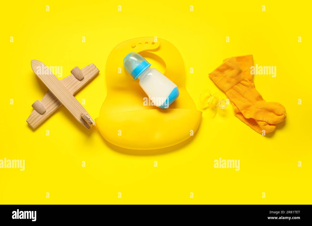 Bottle of milk for baby and accessories on yellow background Stock ...