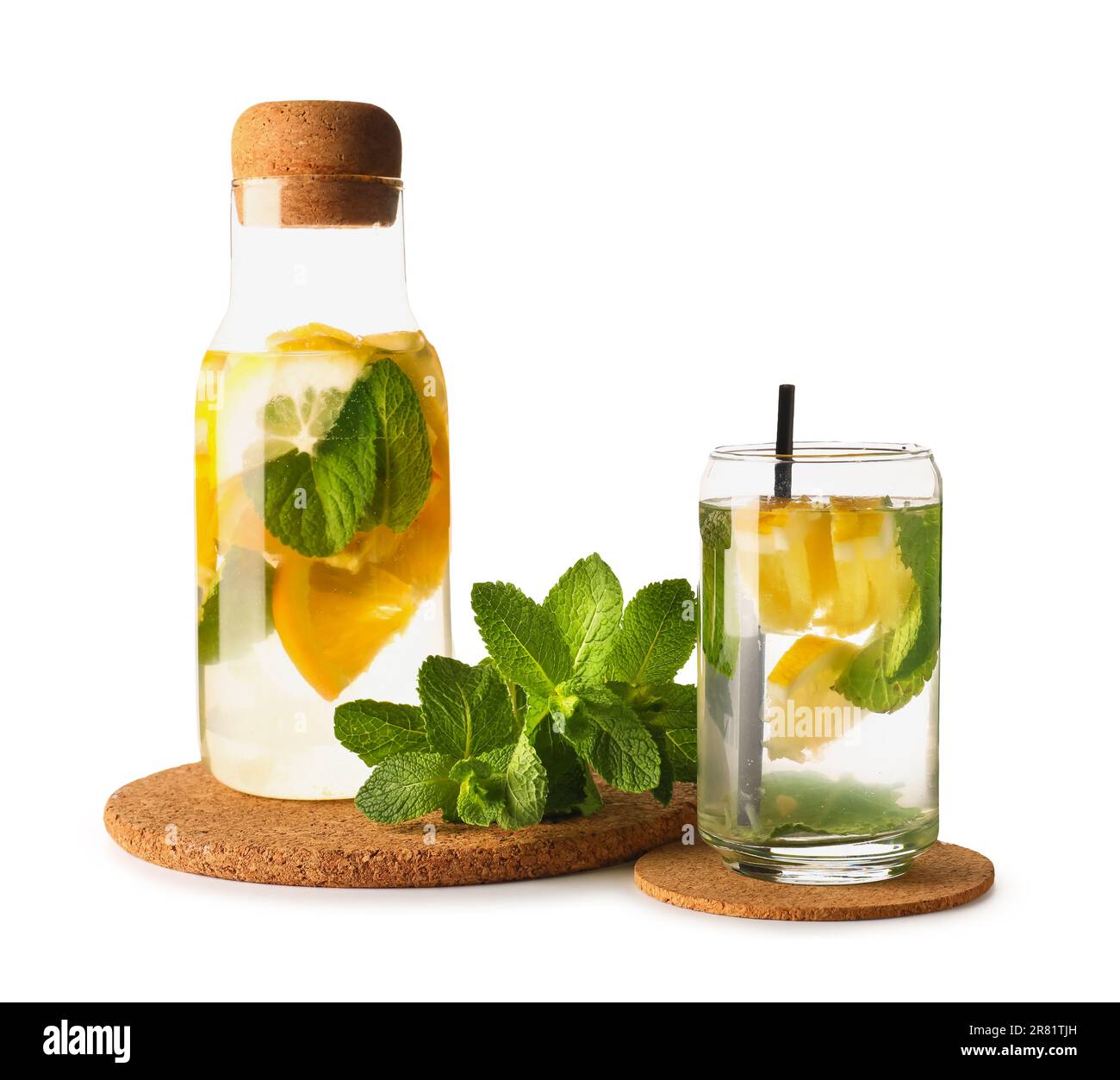 Bottle and glass of infused water with lemon on white background Stock ...