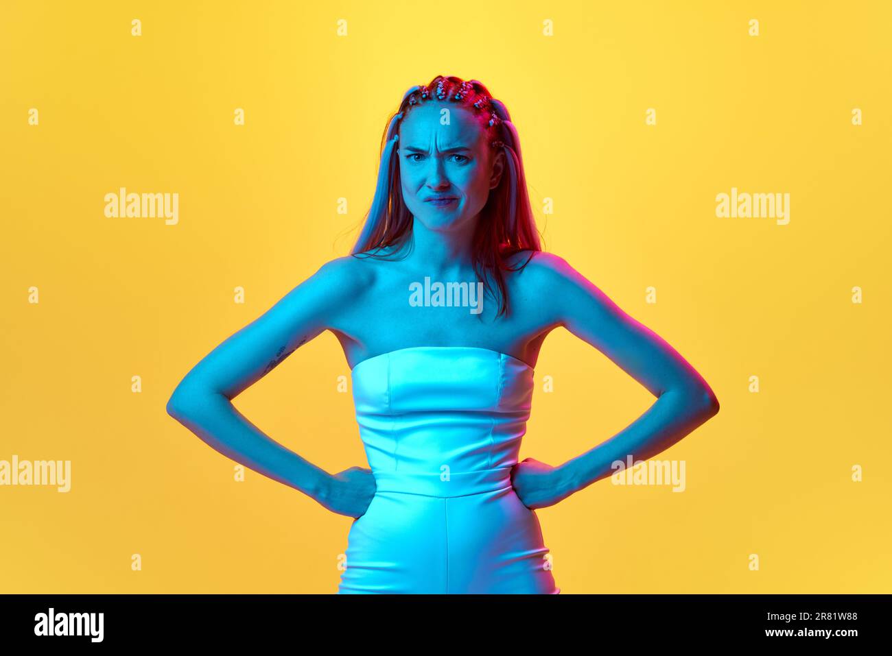 Portrait fo young emotive girl standing with angry, unpleasant face and ...