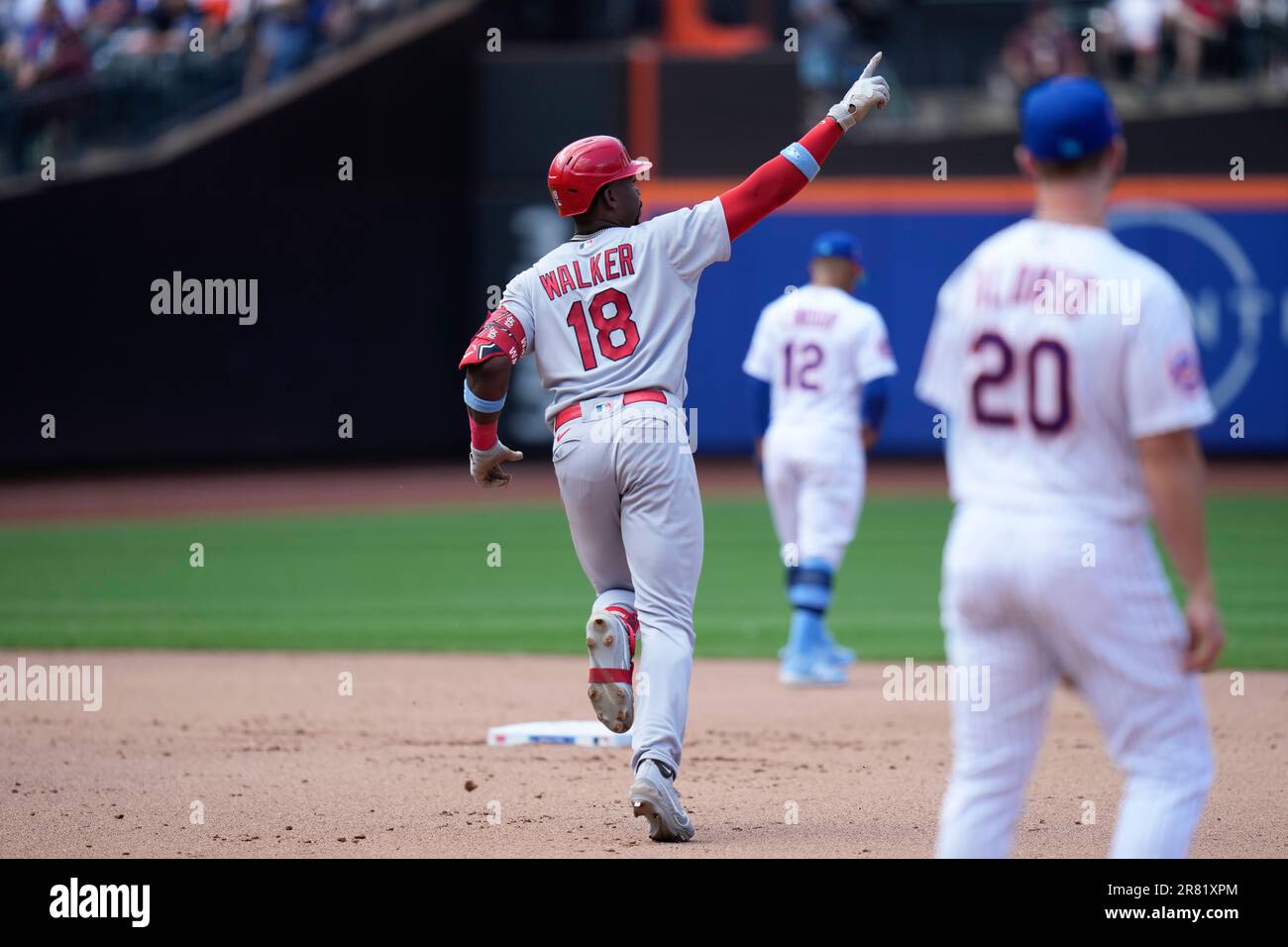 St. Louis Cardinals' Jordan Walker, left, reacts after hitting a home ...