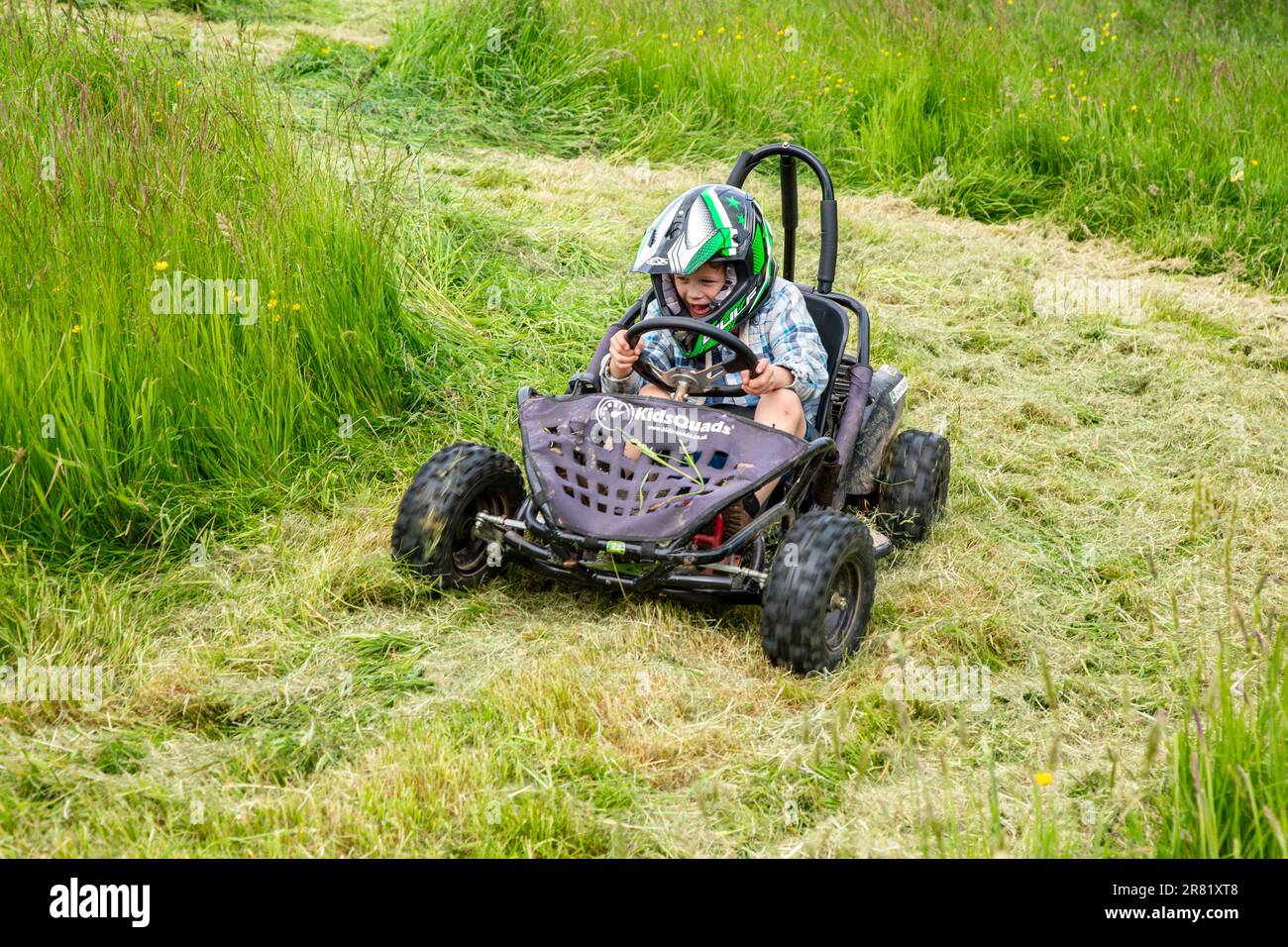 Electric powered Go-Kart racing around a field, High Bickington, North ...