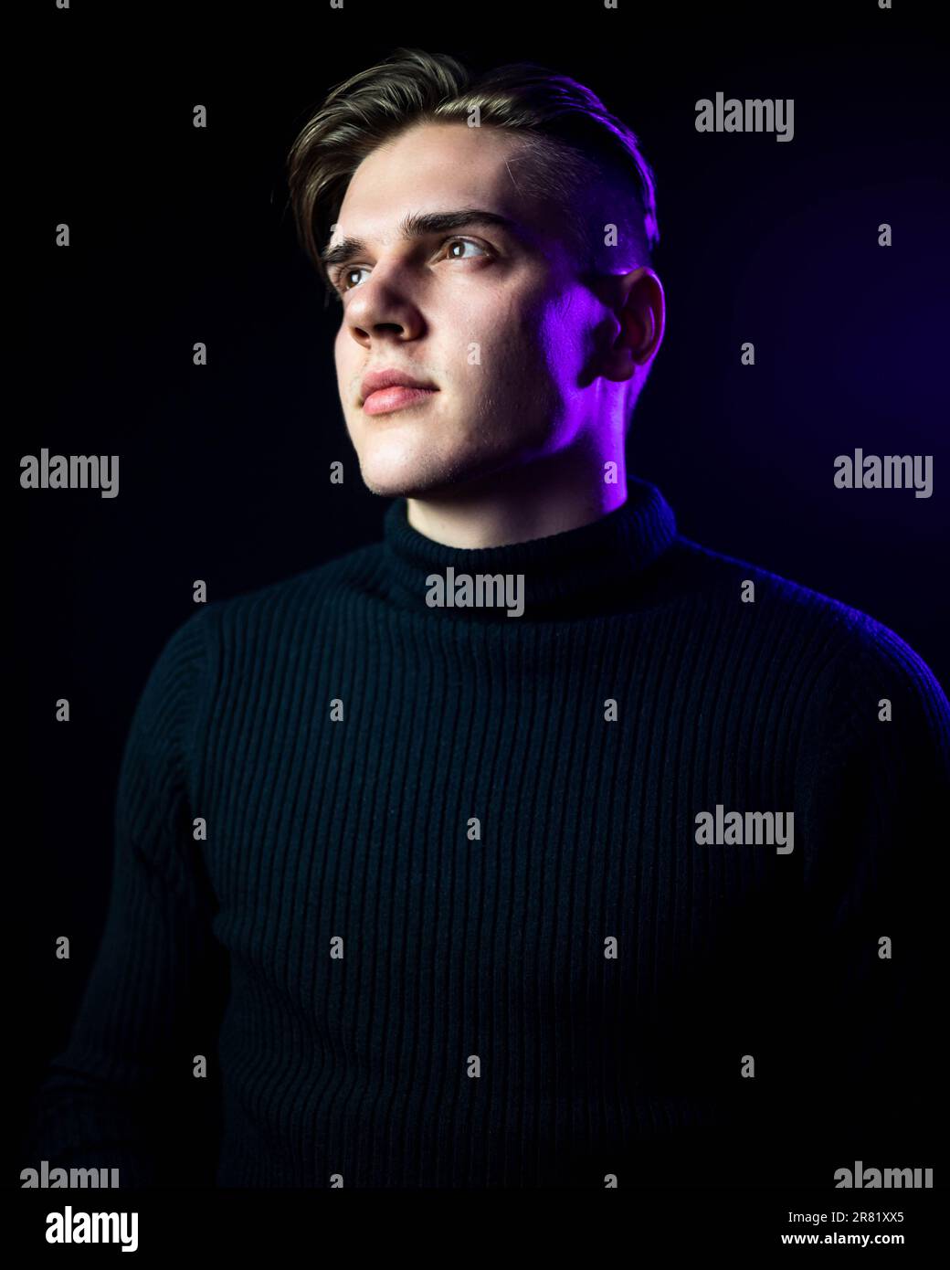 A Portrait of a young male Model with some Purple Highlights on his ...