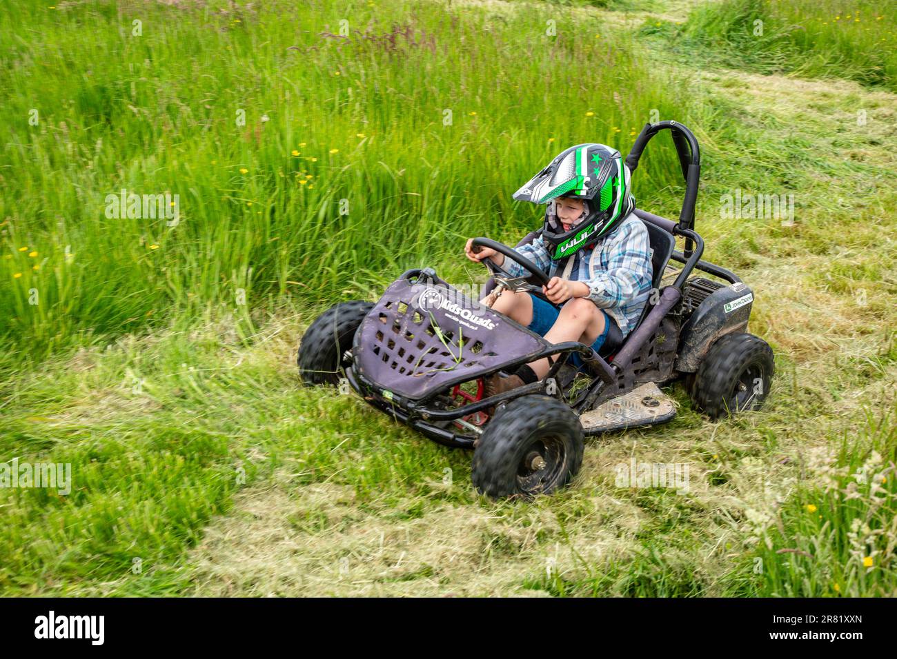 Electric powered Go-Kart racing around a field, High Bickington, North ...