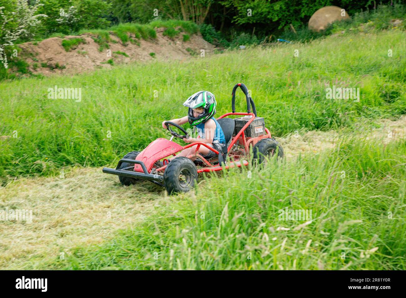 Electric powered Go-Kart racing around a field, High Bickington, North ...