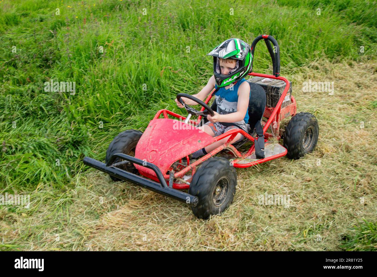 Electric powered Go-Kart racing around a field, High Bickington, North ...
