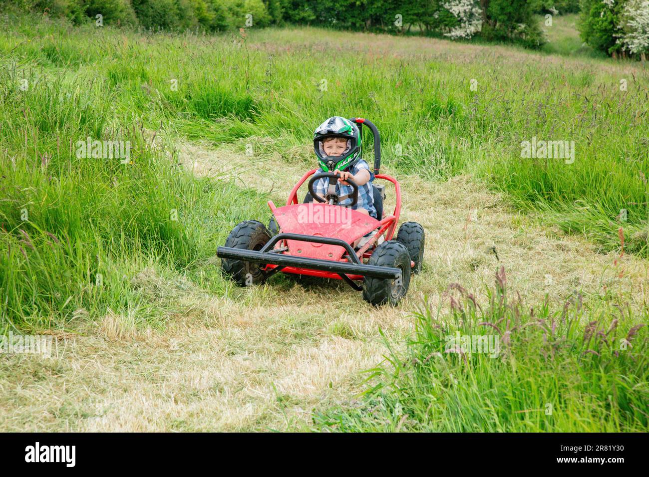 Electric powered Go-Kart racing around a field, High Bickington, North ...
