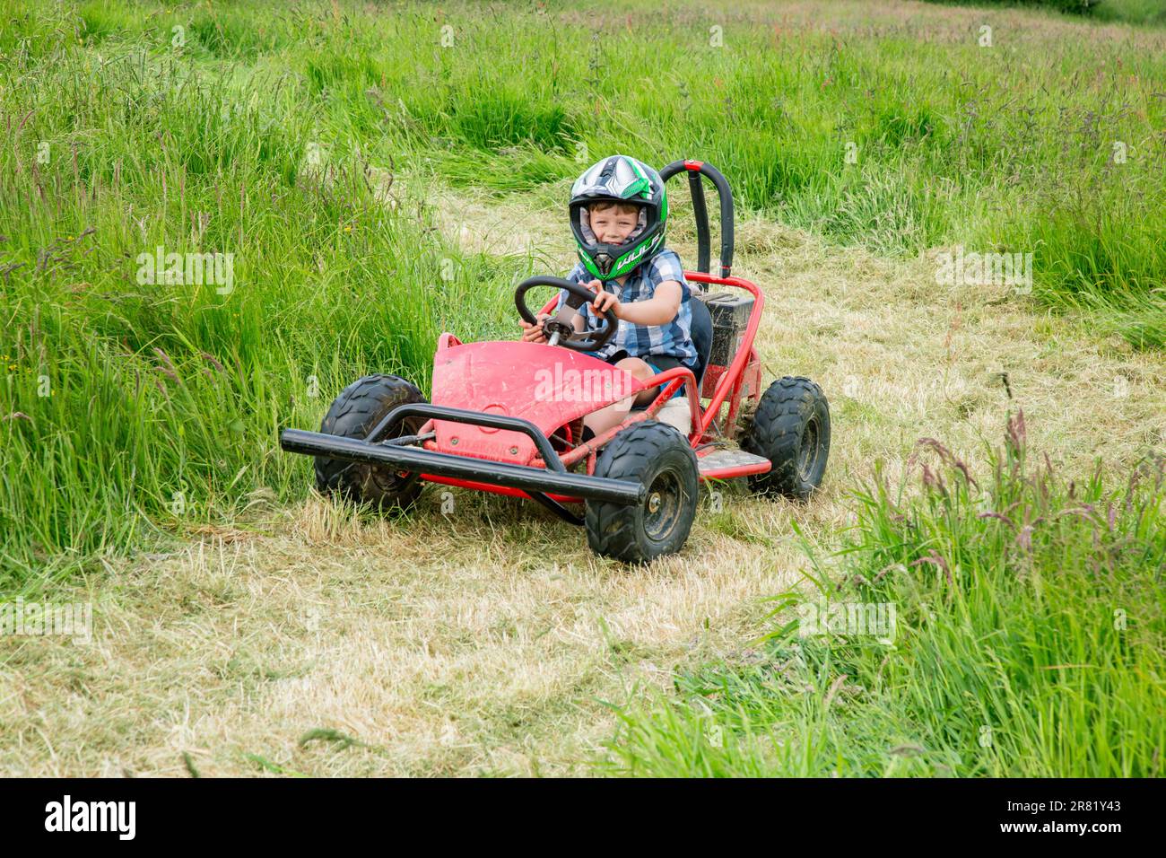 Electric powered Go-Kart racing around a field, High Bickington, North ...
