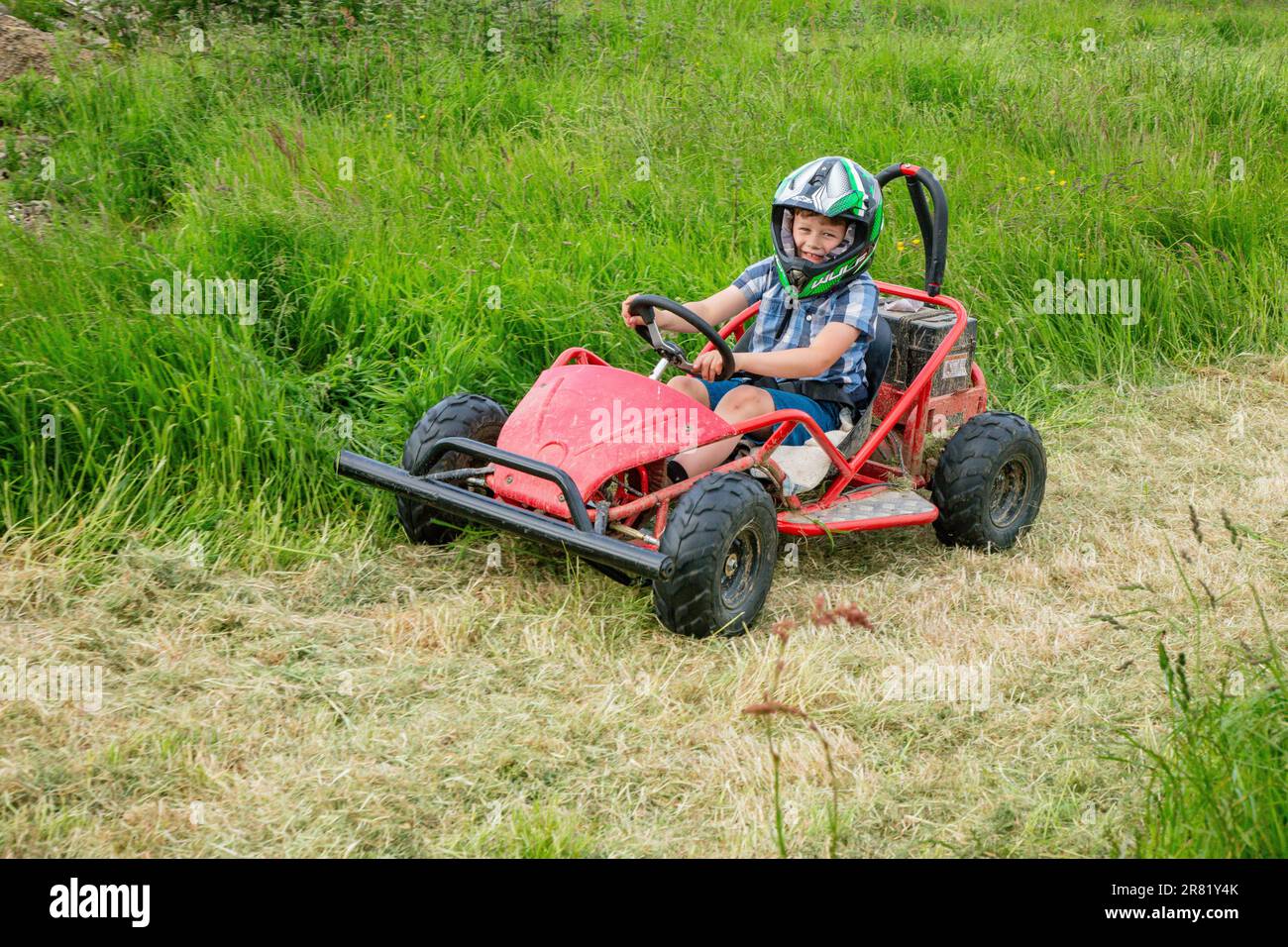 Electric powered Go-Kart racing around a field, High Bickington, North ...