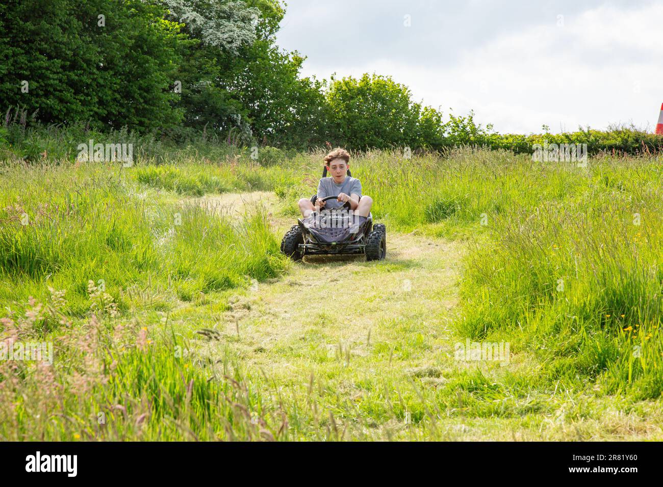 Electric powered Go-Kart racing around a field, High Bickington, North ...