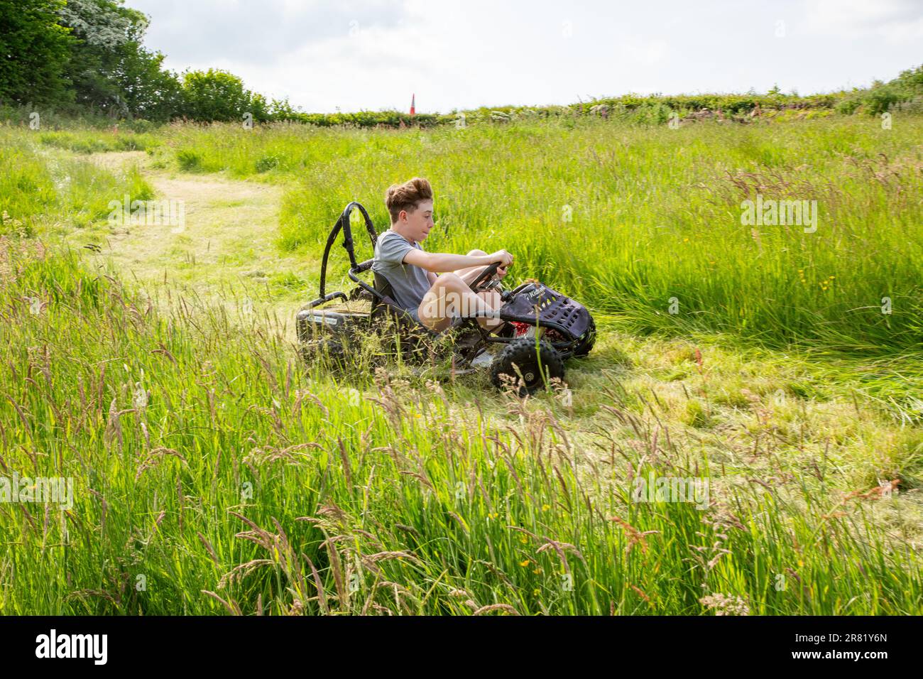 Electric powered Go-Kart racing around a field, High Bickington, North ...