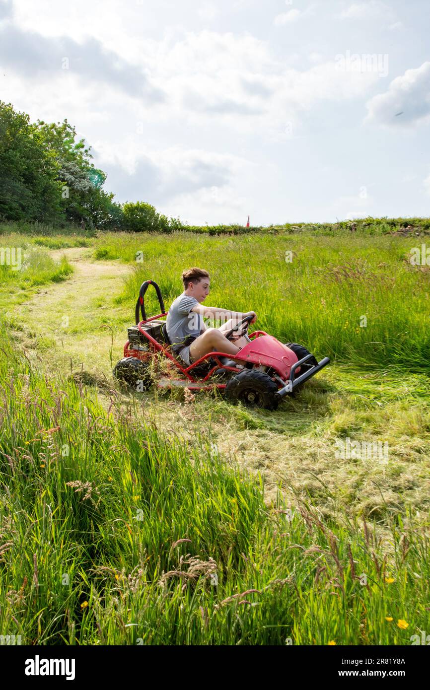Electric powered Go-Kart racing around a field, High Bickington, North ...