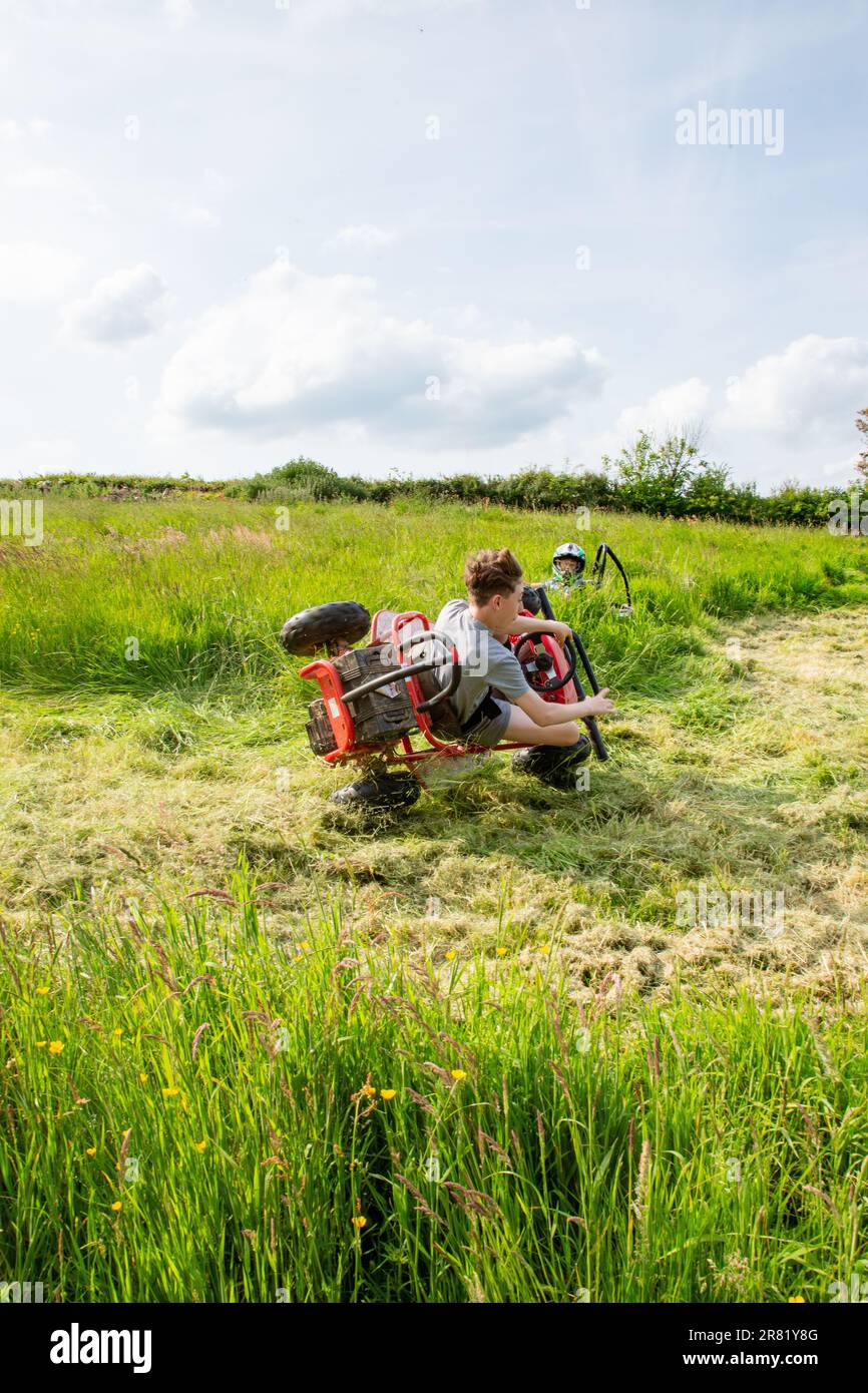 Electric powered Go-Kart racing around a field, High Bickington, North ...