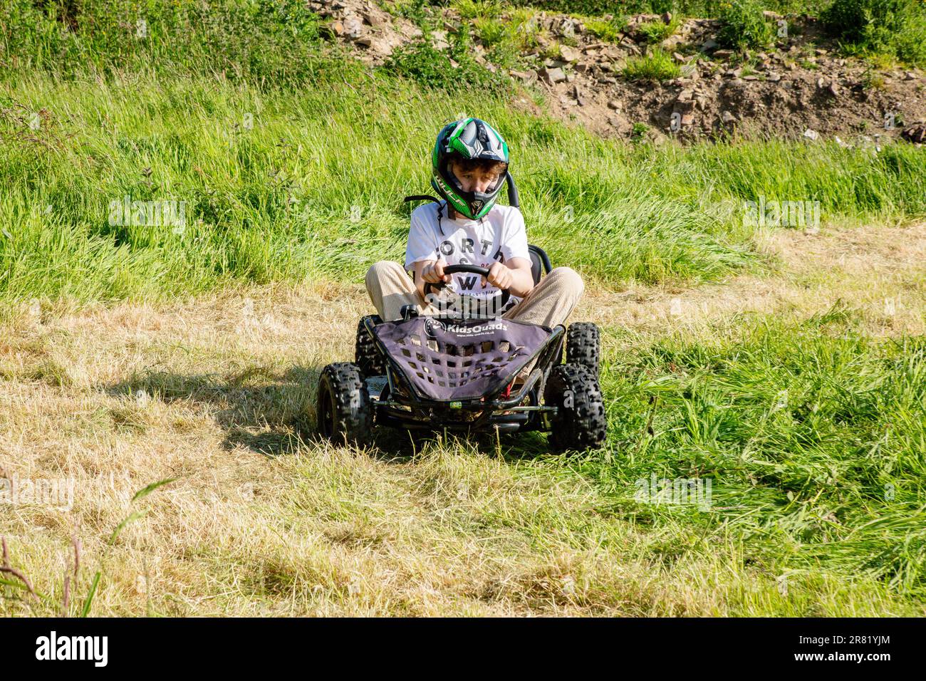 Electric powered Go-Kart racing around a field, High Bickington, North ...