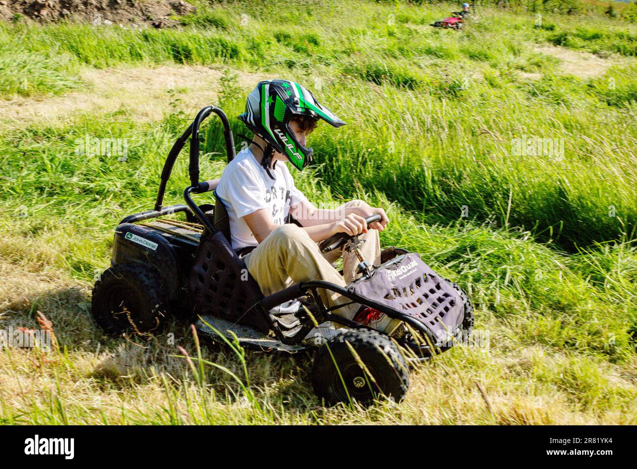 Electric powered Go-Kart racing around a field, High Bickington, North ...