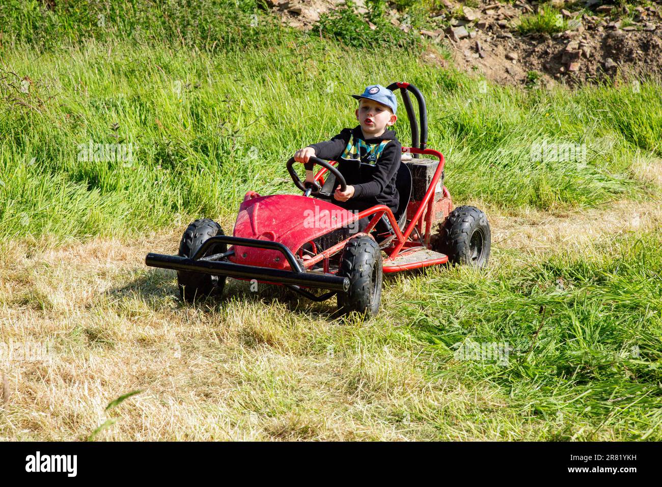 Electric powered Go-Kart racing around a field, High Bickington, North ...