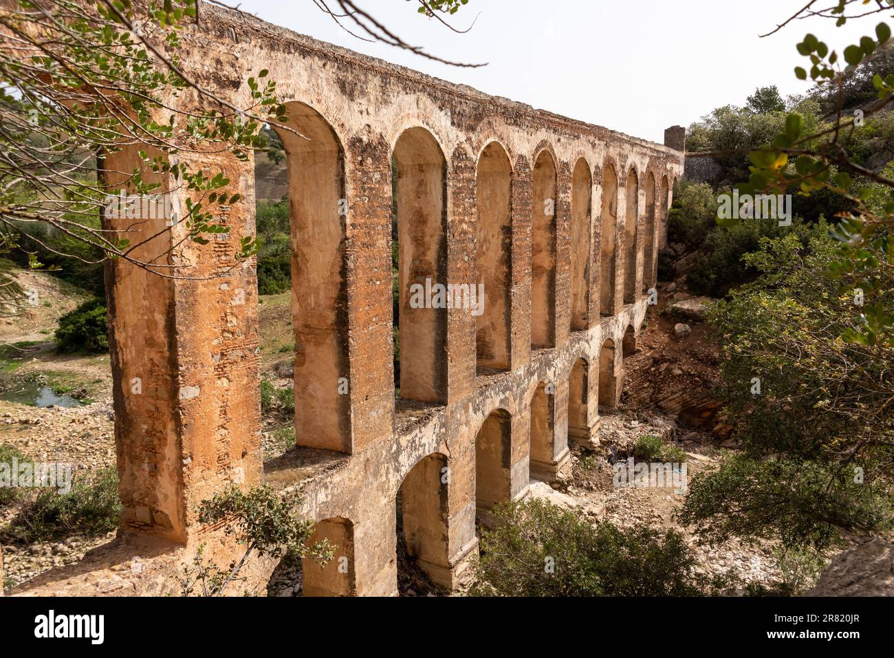 Ancient Haroune aqueduct near the archeological Roman city of Volubilis ...