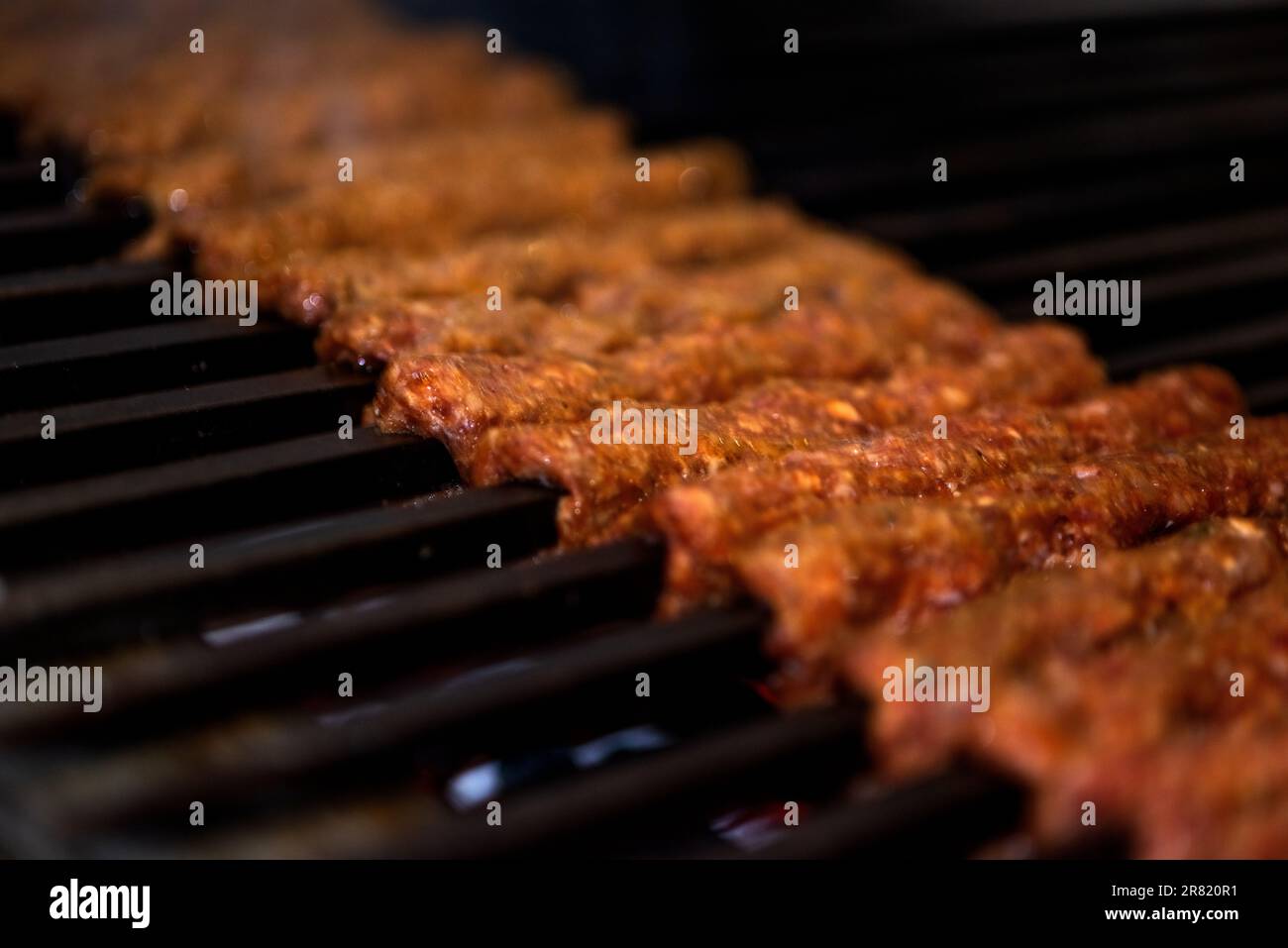 Making Spicy seekh kebabs are being grilled on burning charcoal in ...