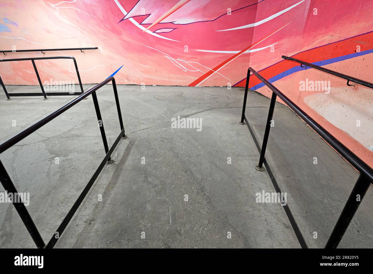 Handicapped down ramp with urban art on walls Stock Photo - Alamy