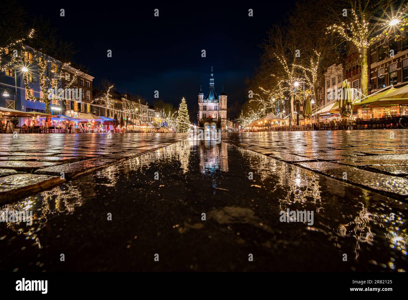 A beautiful low angle shot of an empty street at night with lights and ...