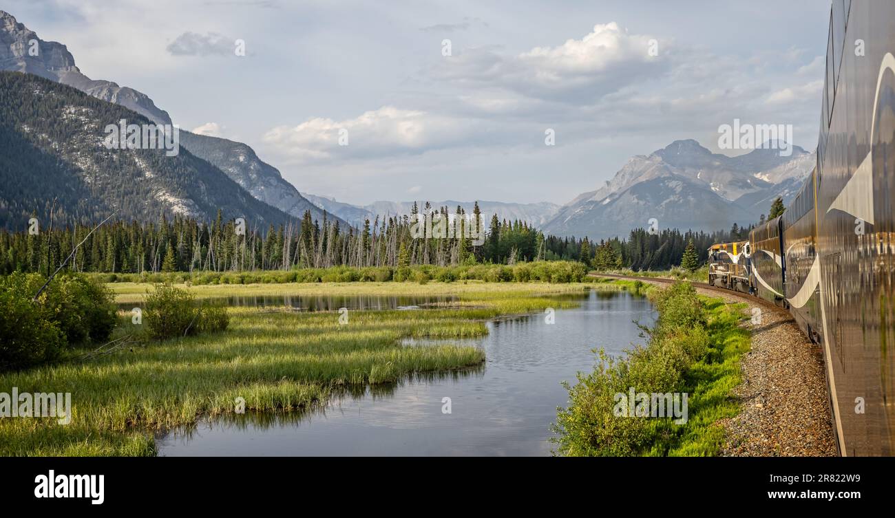 Rocky Mountaineer luxury train rounding bend along River in the Rocky ...