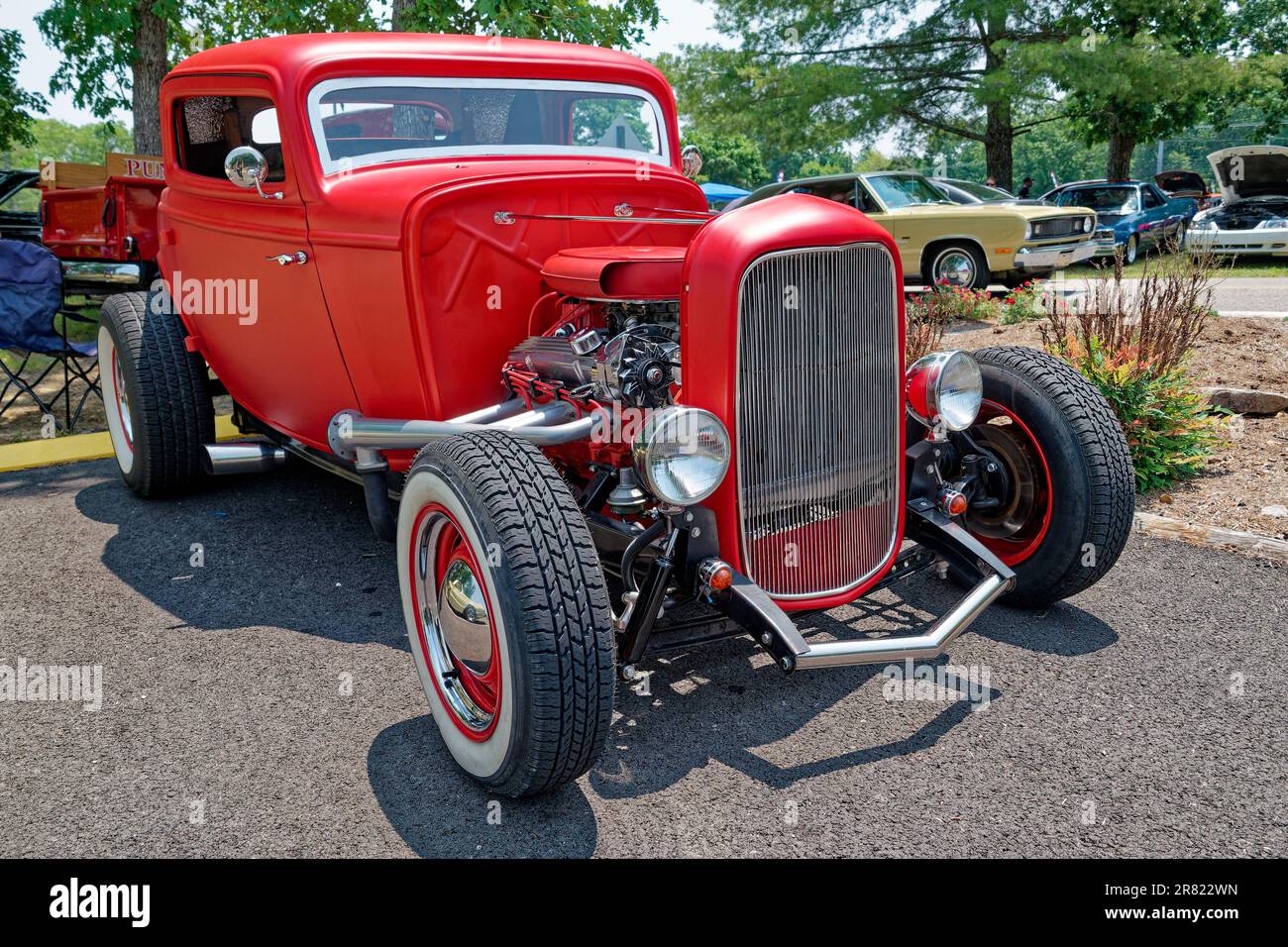 Bright red restoration customized hot rod with white wall tires and a ...