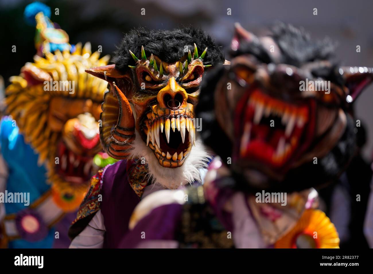 Dancers wearing devil masks perform during a Corpus Christi procession ...