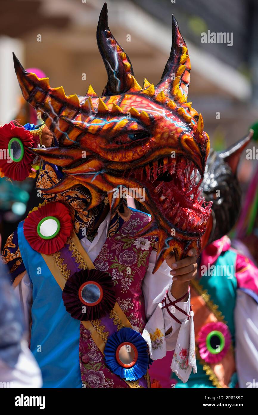 Dancers wearing devil masks perform during a Corpus Christi procession ...
