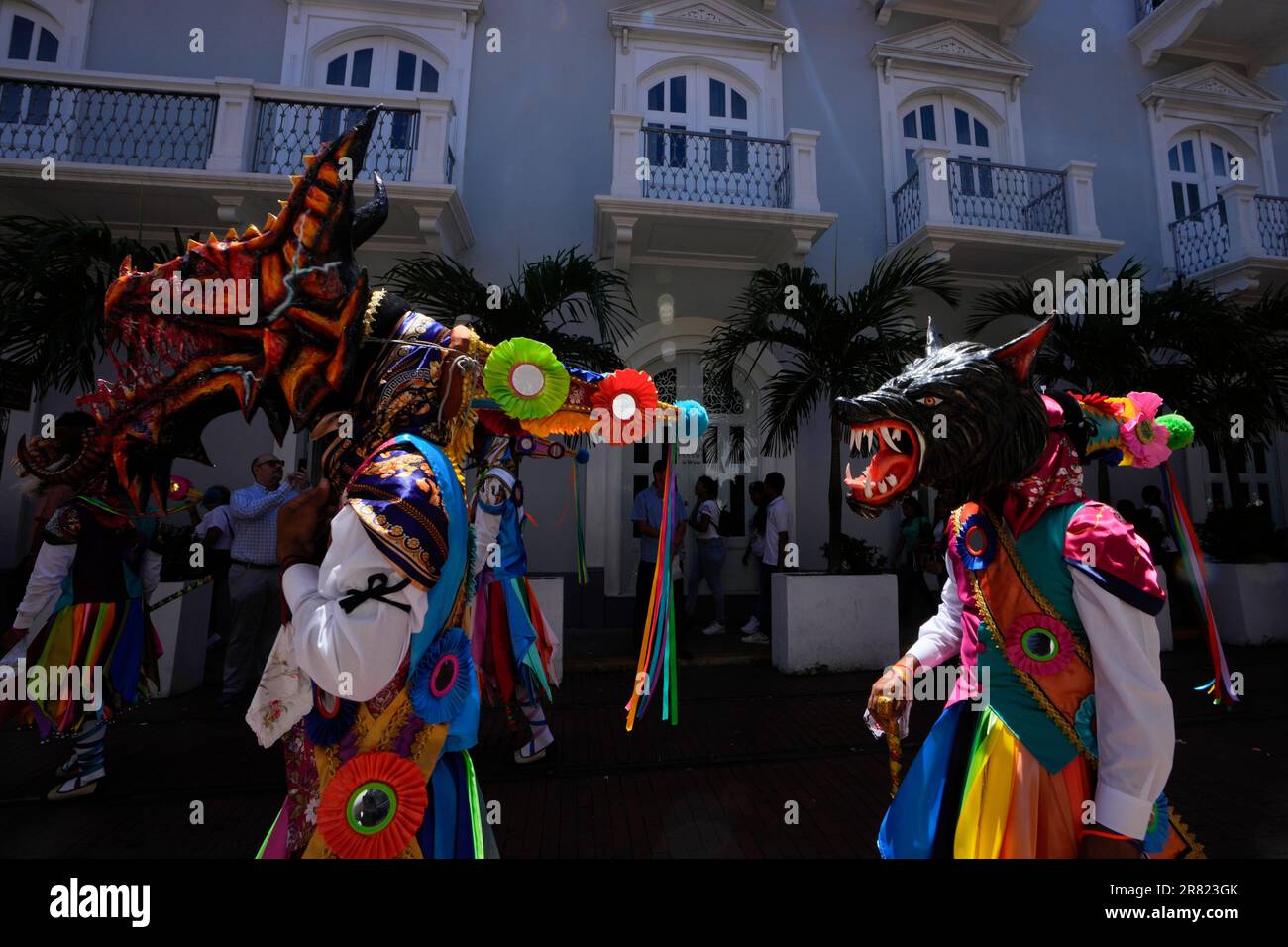 Dancers wearing devil masks perform during a Corpus Christi procession ...