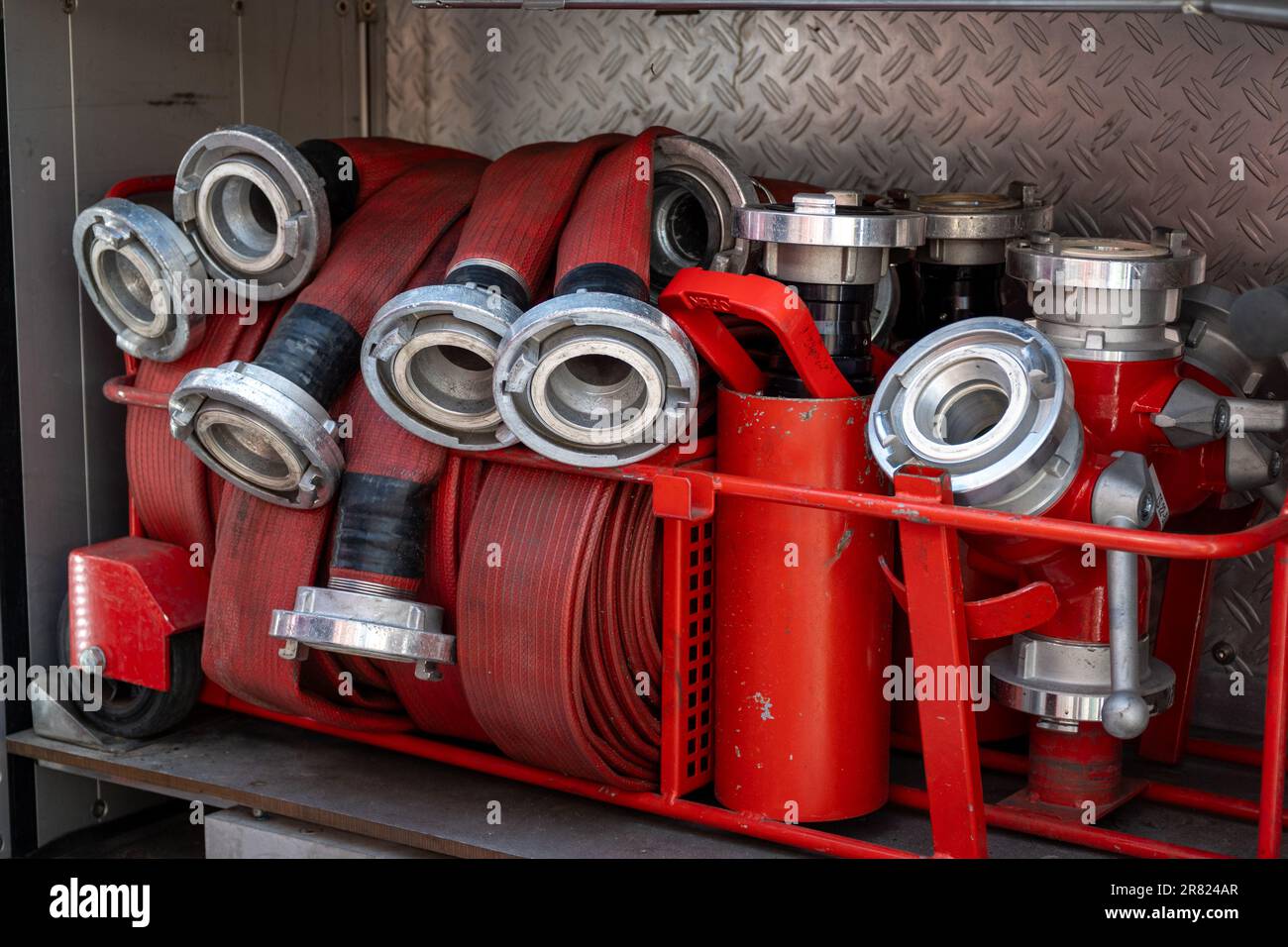 Fire engine equipment from the inside - fire hose hoses ready for use ...