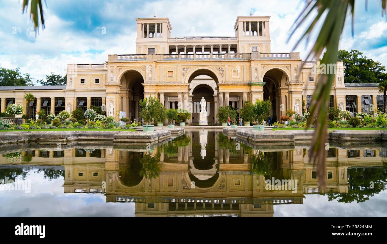 An exquisite house featuring a picturesque view of a tranquil body of ...