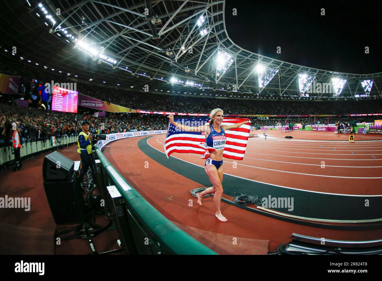Emma Coburn celebrating her medal with her country's flag in the 3000 ...