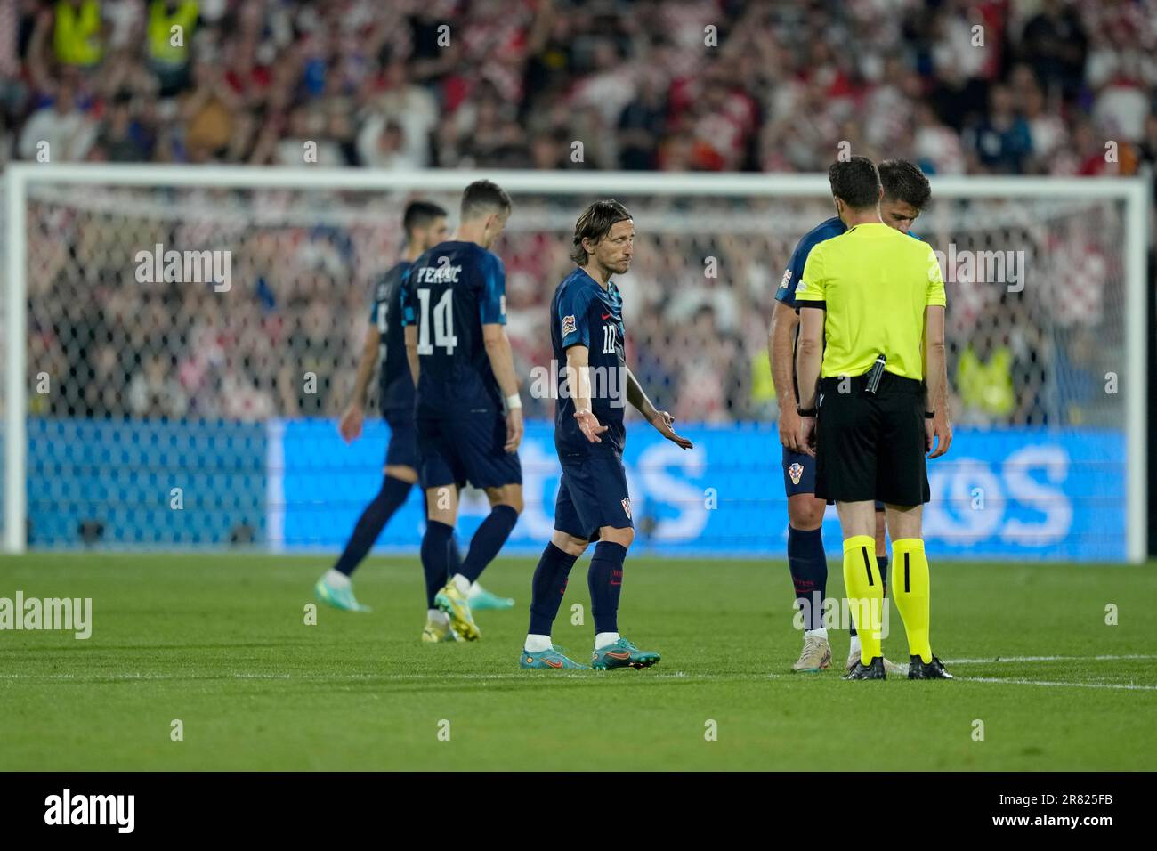 Croatia's Luka Modric, center, gestures to Referee Felix Zwayer during ...