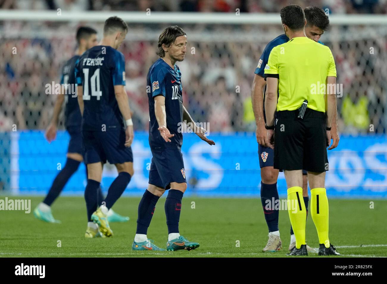 Croatia's Luka Modric, center, gestures to Referee Felix Zwayer during ...