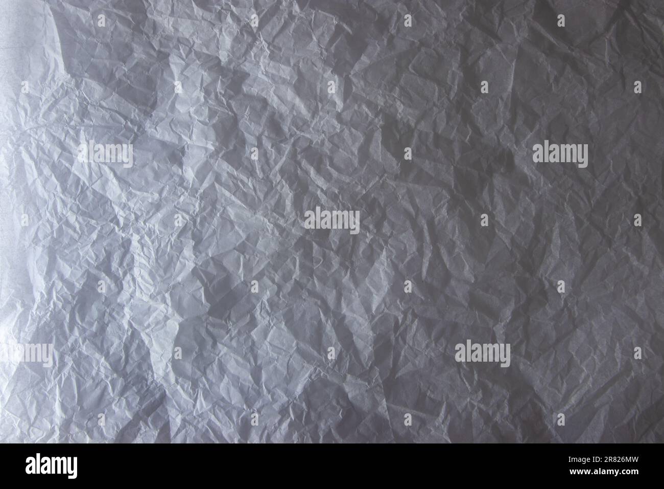 Crinkled white wrapping paper. Light and shadow contrast background ...