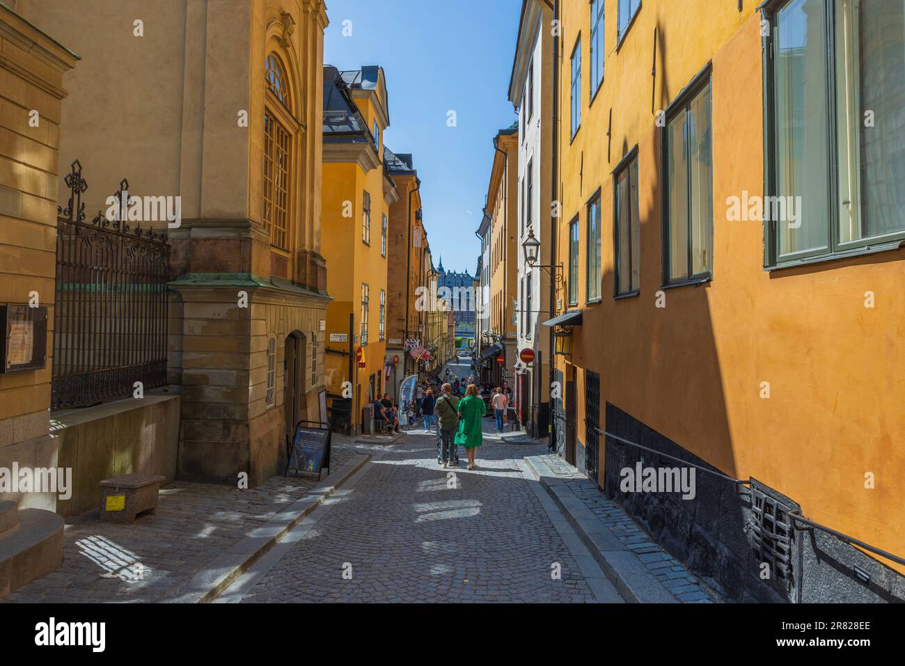 Beautiful view of people on narrow cobbled streets of Stockholm's old ...