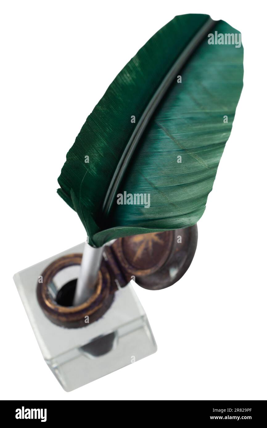 Old vintage feather quill with glass inkwell isolated on white ...