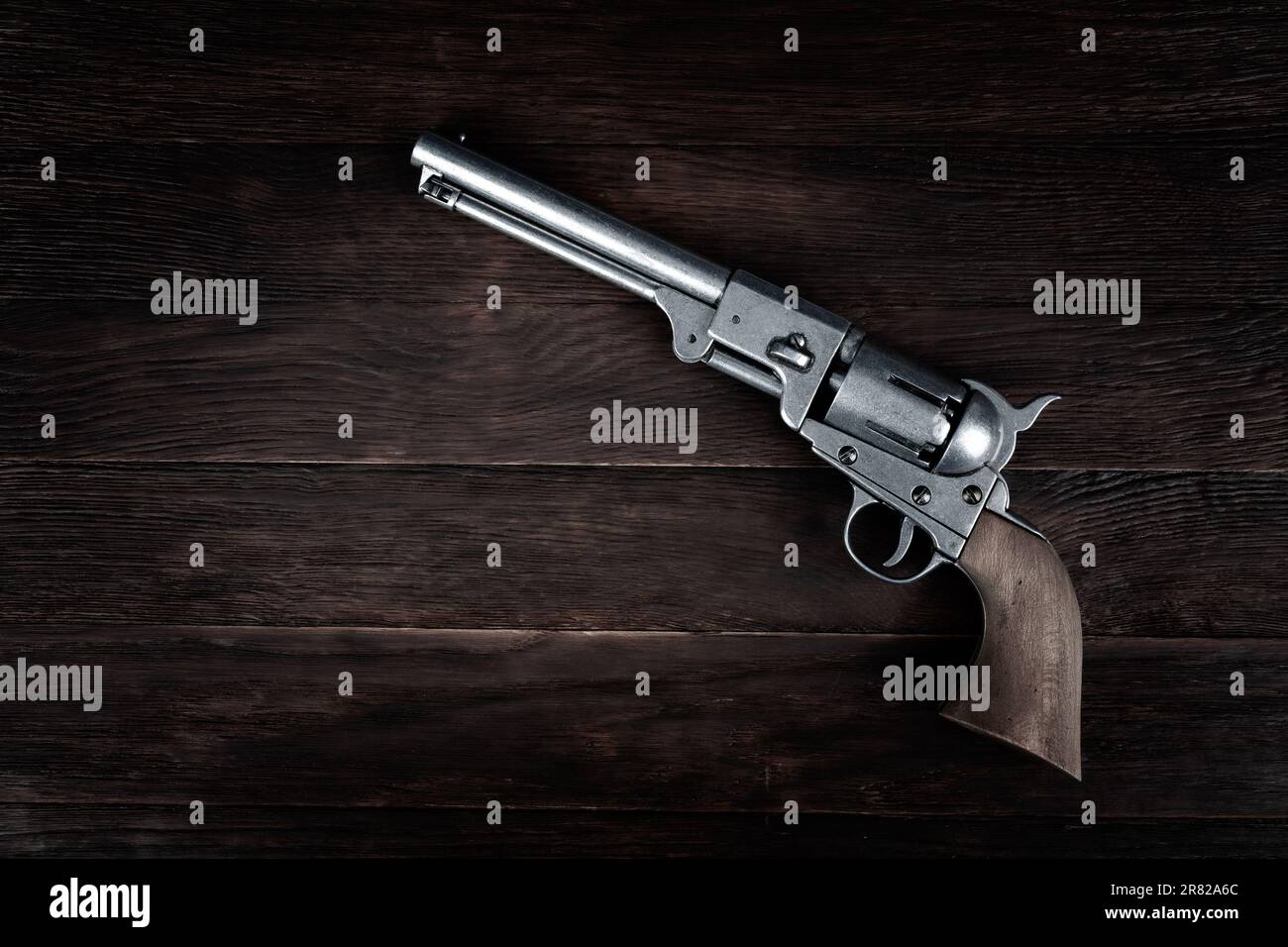Old west gun. Colt Revolver on wooden deck. Sepia tone Stock Photo - Alamy