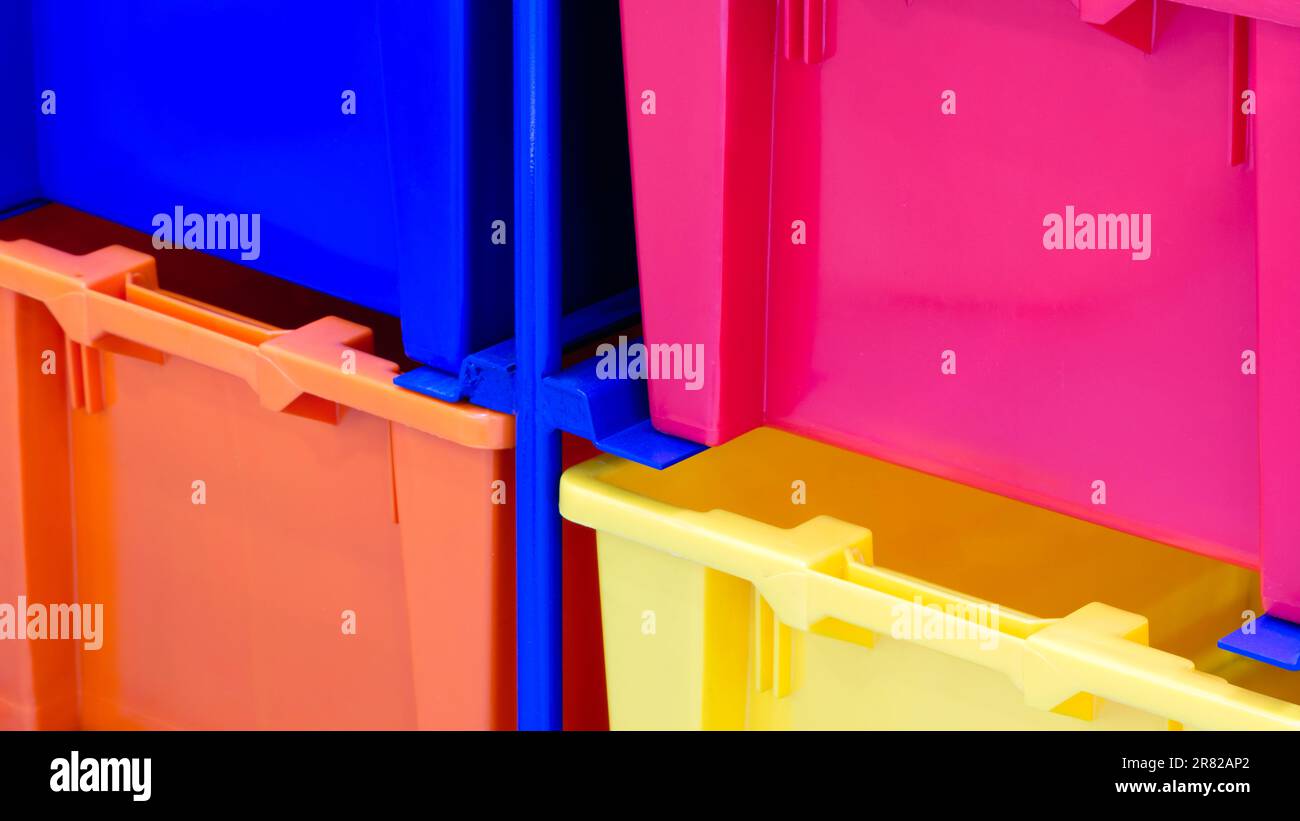 Colorful plastic boxes, logistic concept Stock Photo - Alamy