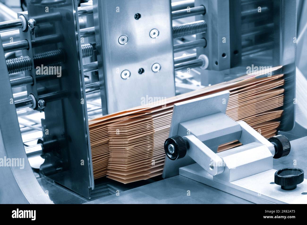 Elements of corton boxes are collected in stack. Conveyor line for the ...